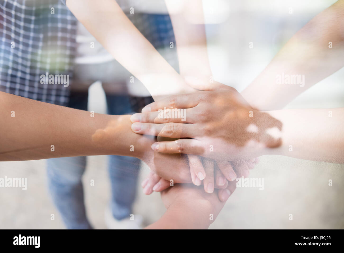 young college student joining united hand, business team touching hands ...