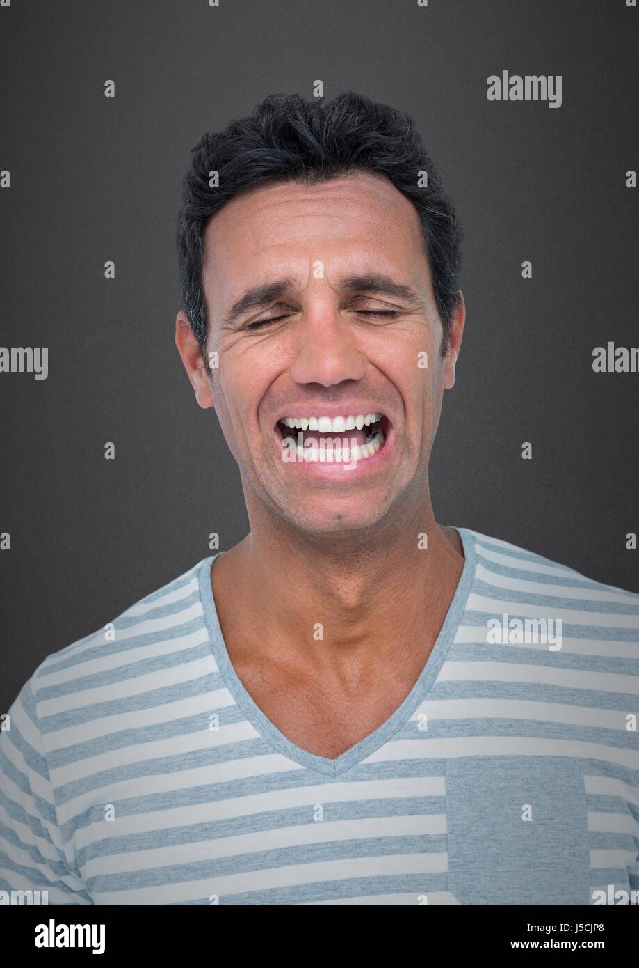 Digital composite of Man crying against grey wall Stock Photo - Alamy