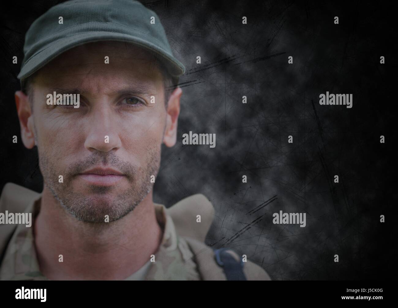 Digital composite of Transparent soldier face against black grunge ...