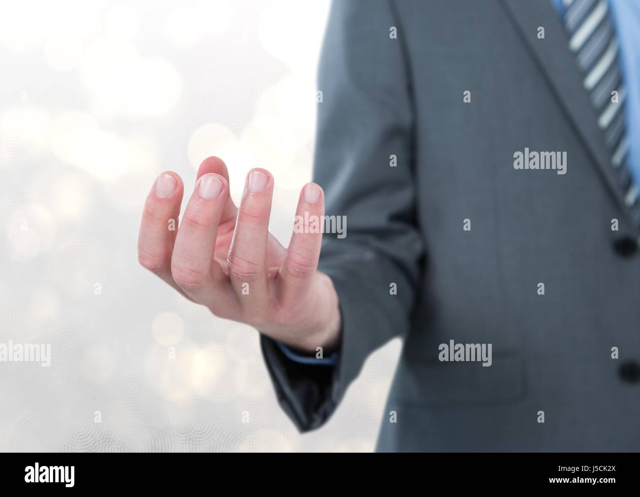 Digital composite of Midsection of professional holding invisible ...