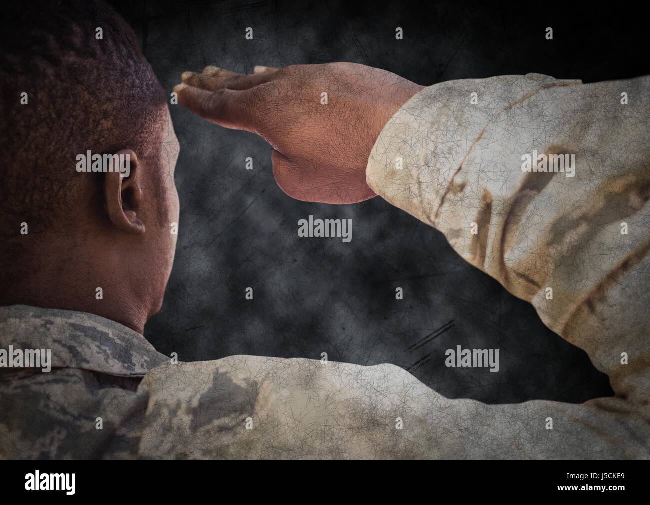 Digital composite of Back of soldier saluting with black grunge ...