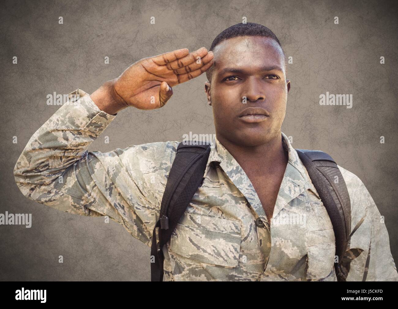 Digital composite of Soldier saluting against brown background with ...
