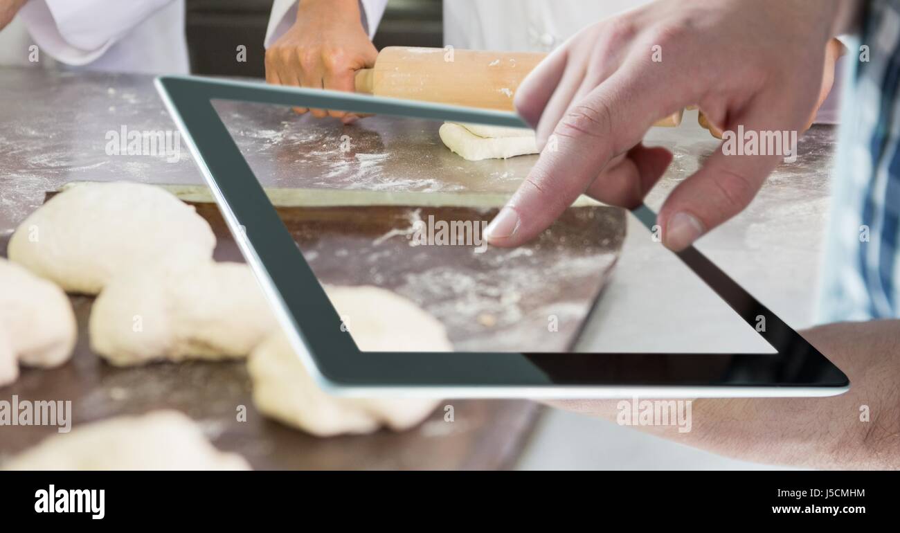 Digital composite of Hand taking picture of dough with tablet PC in ...