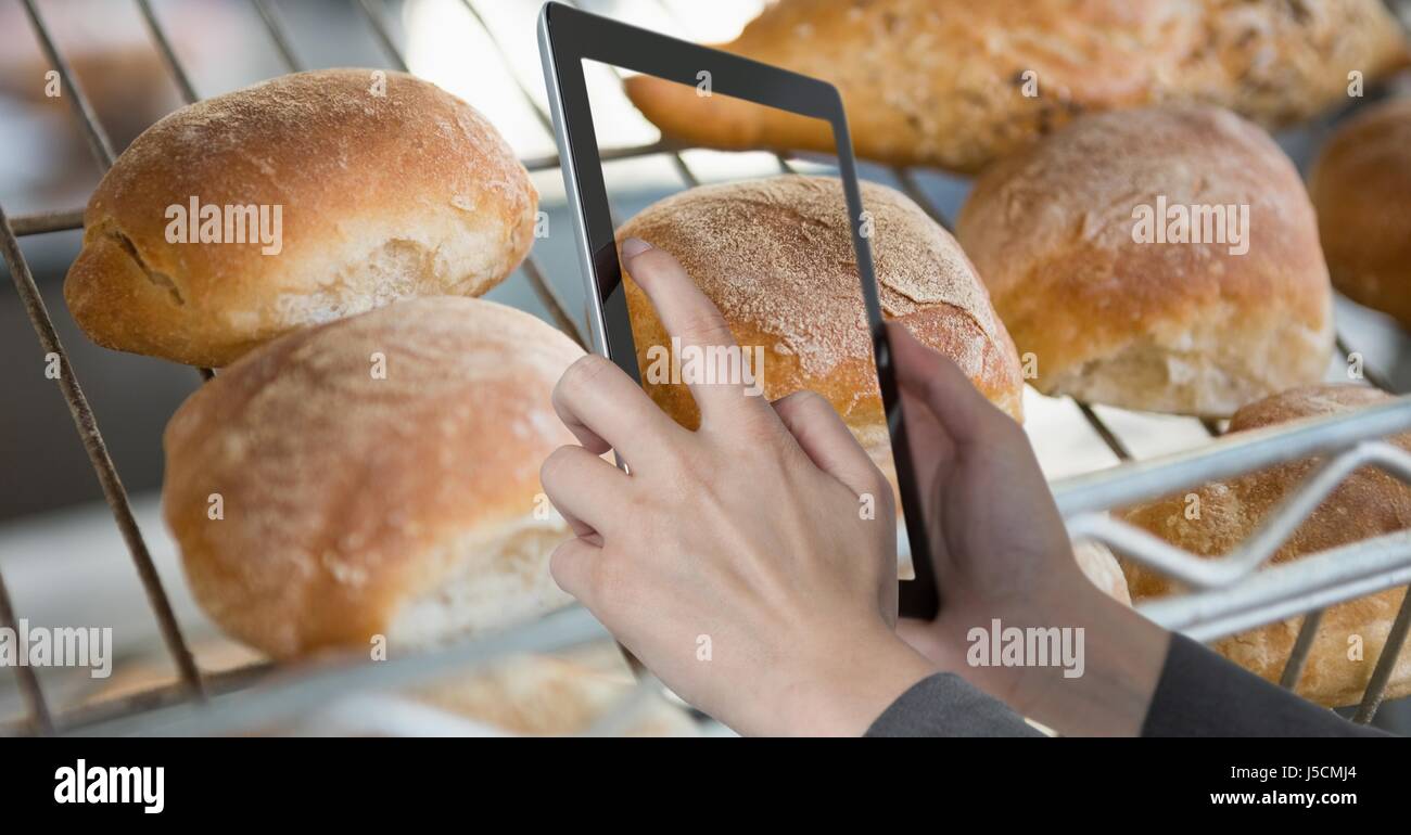 Digital composite of Hands photographing breads through tablet computer ...