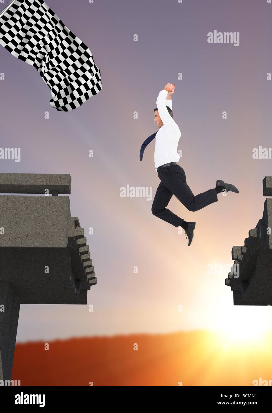 Digital composite of businessman jumping to catch the checker flag ...