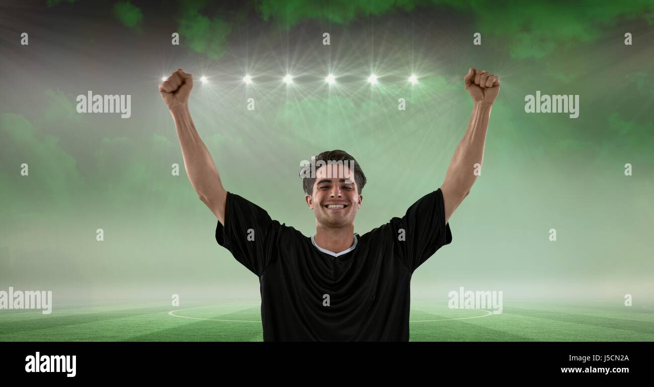 Digital composite of Happy soccer player with arms raised celebrating ...