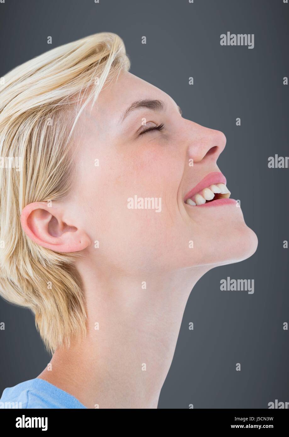 Digital composite of Close up profile of woman eyes closed against grey ...