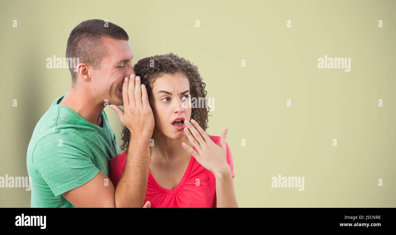 Digital composite of Man whispering in woman's ear over colored ...