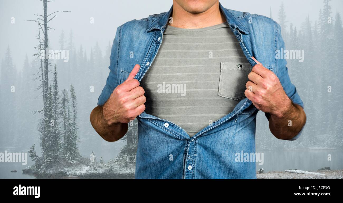 Digital composite of Midsection of male hipster pulling his shirt like ...
