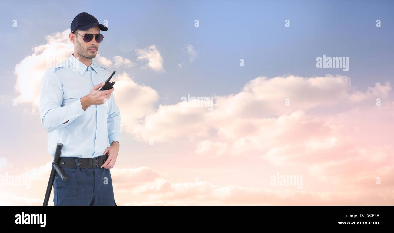 Digital composite of Security guard holding radio against sky Stock ...