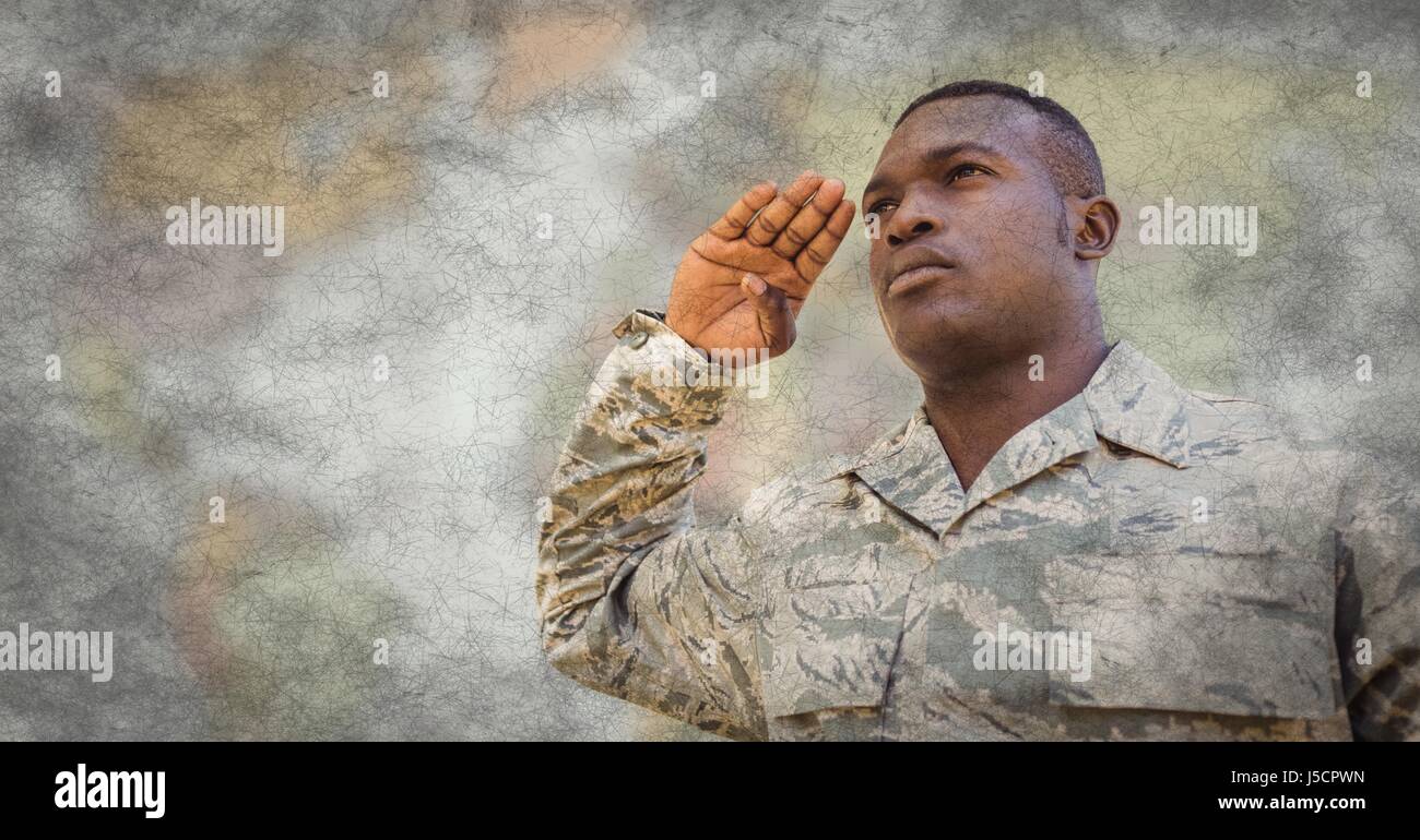Digital composite of Soldier saluting against blurry map with grunge ...
