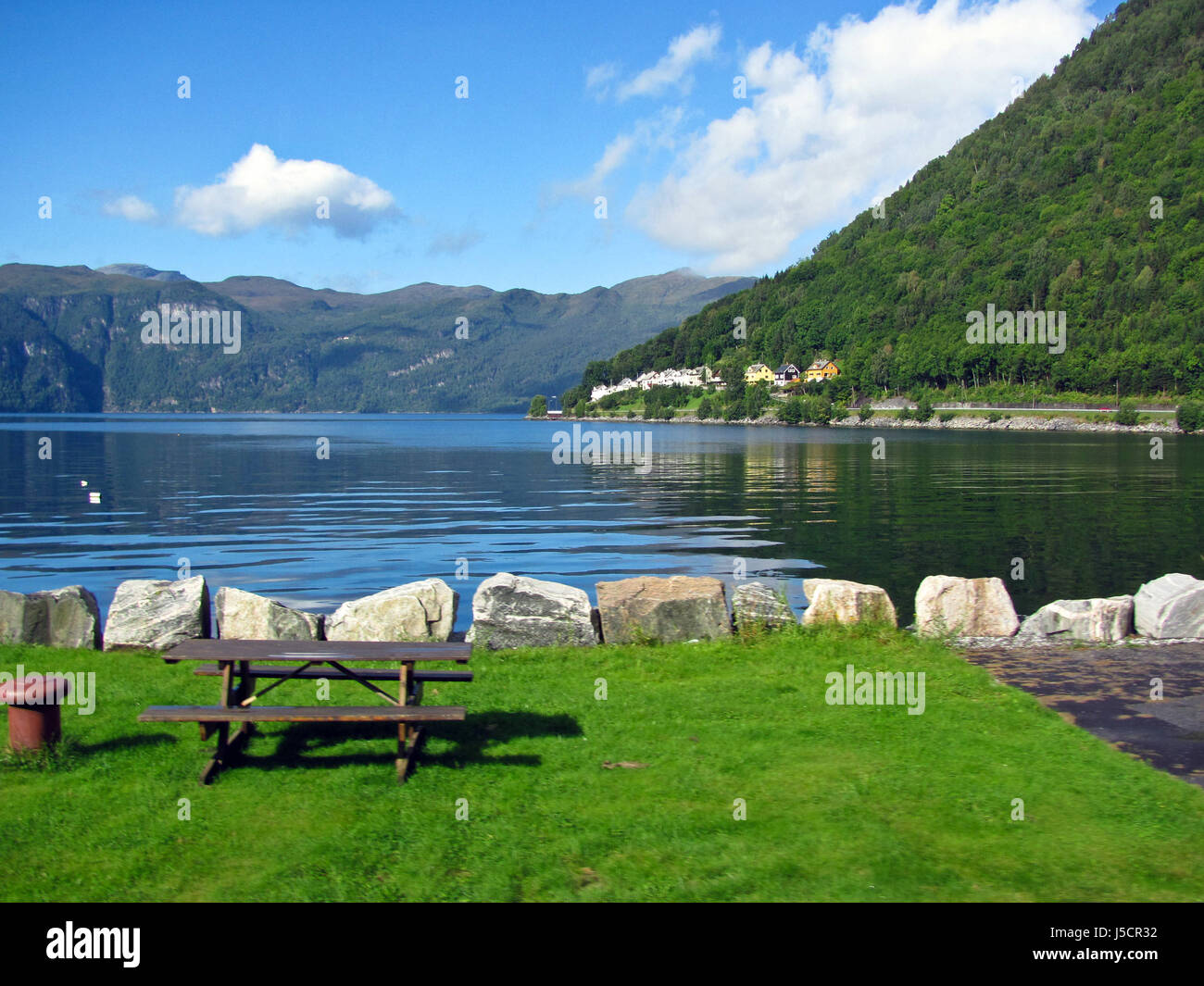 A bench and a beautiful view of the sea and mountains, Norway Stock ...