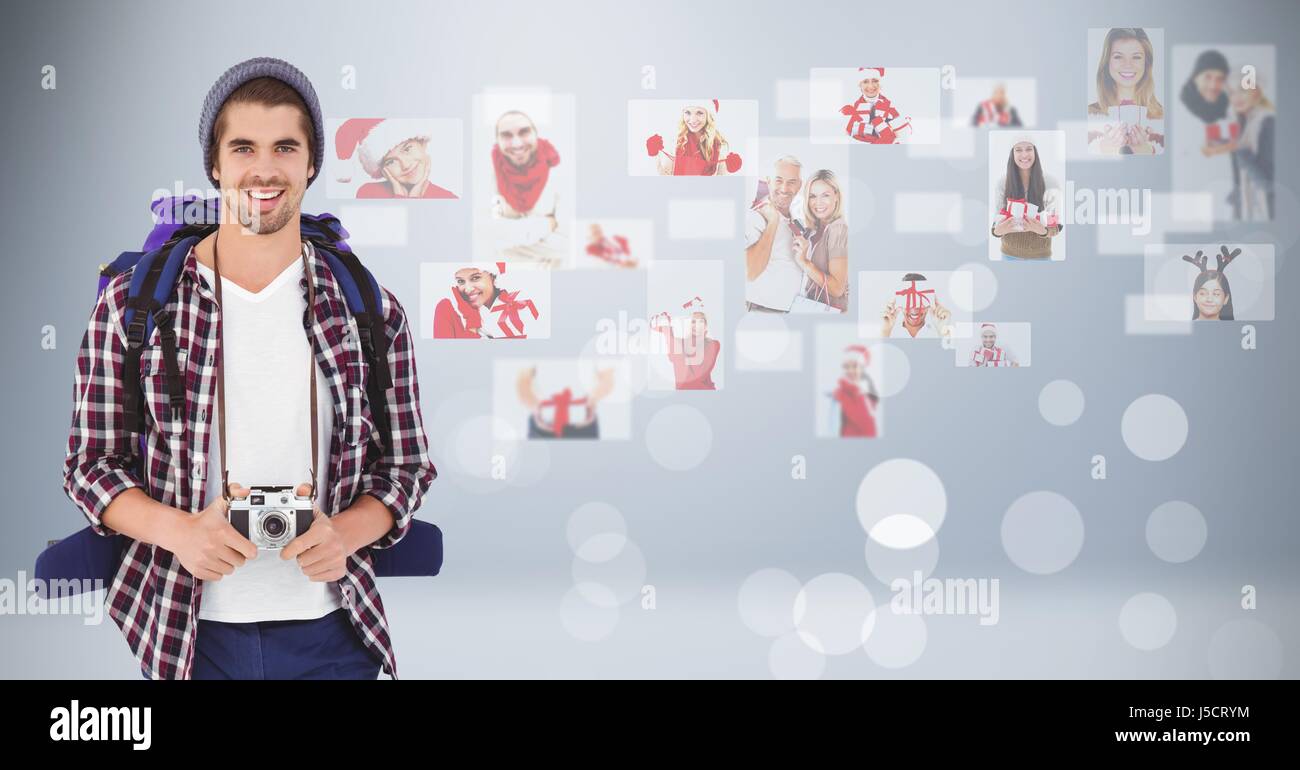 Digital composite of Portrait of photographer with flying portraits ...