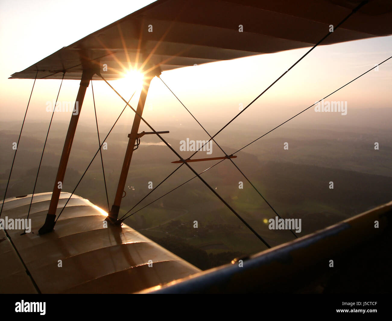 fly flies flys flying biplane double decker story sunset wing freedom ...