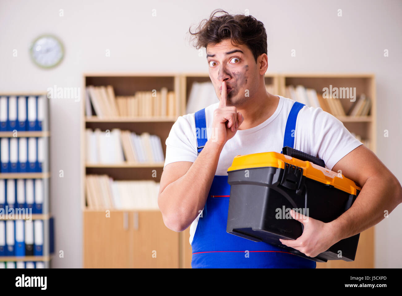 Funny Man doing electrical repairs at home Stock Photo - Alamy