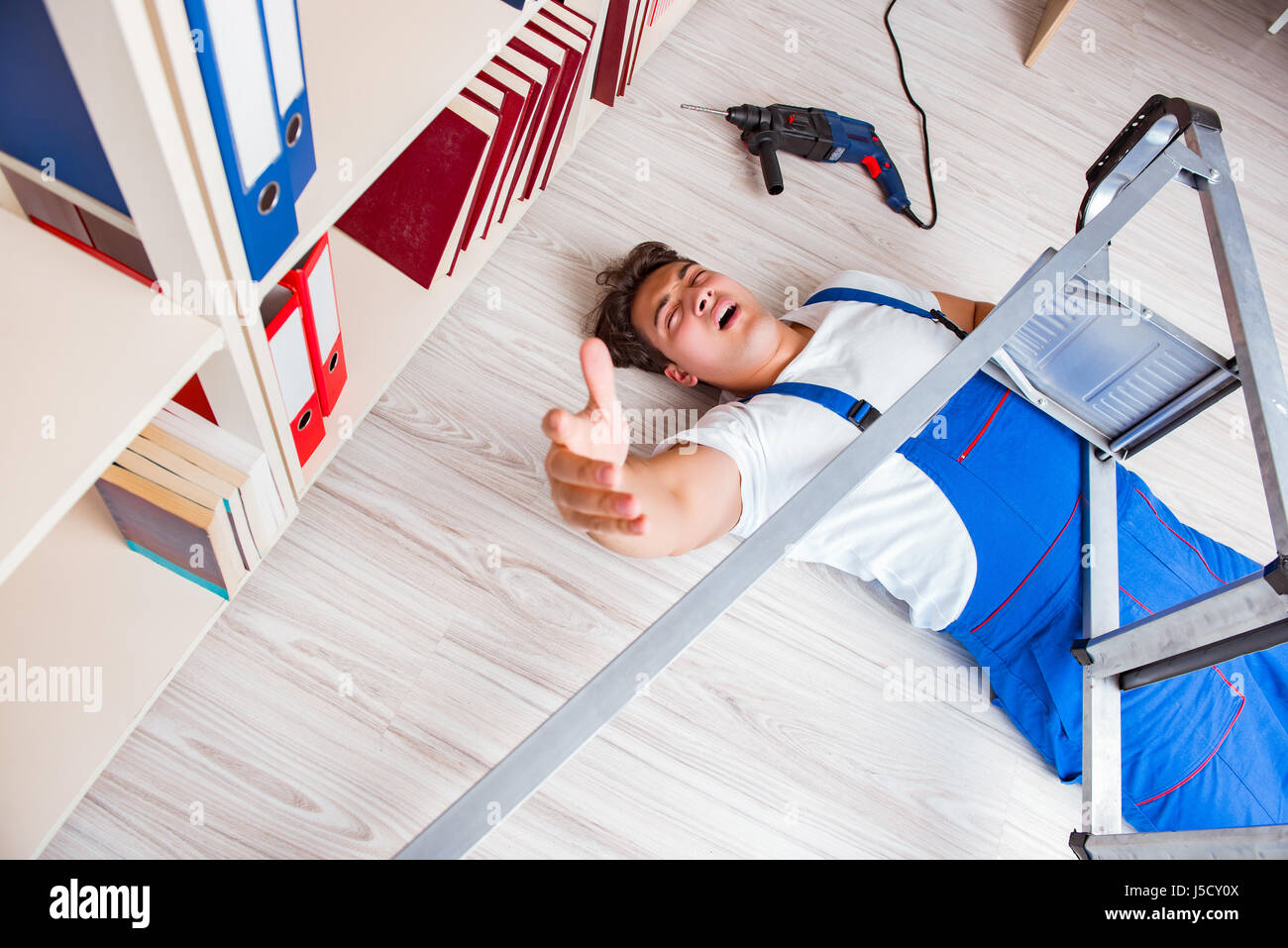 Unsafe behavior concept with falling worker Stock Photo - Alamy