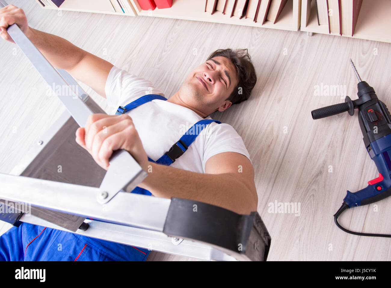 Unsafe behavior concept with falling worker Stock Photo - Alamy
