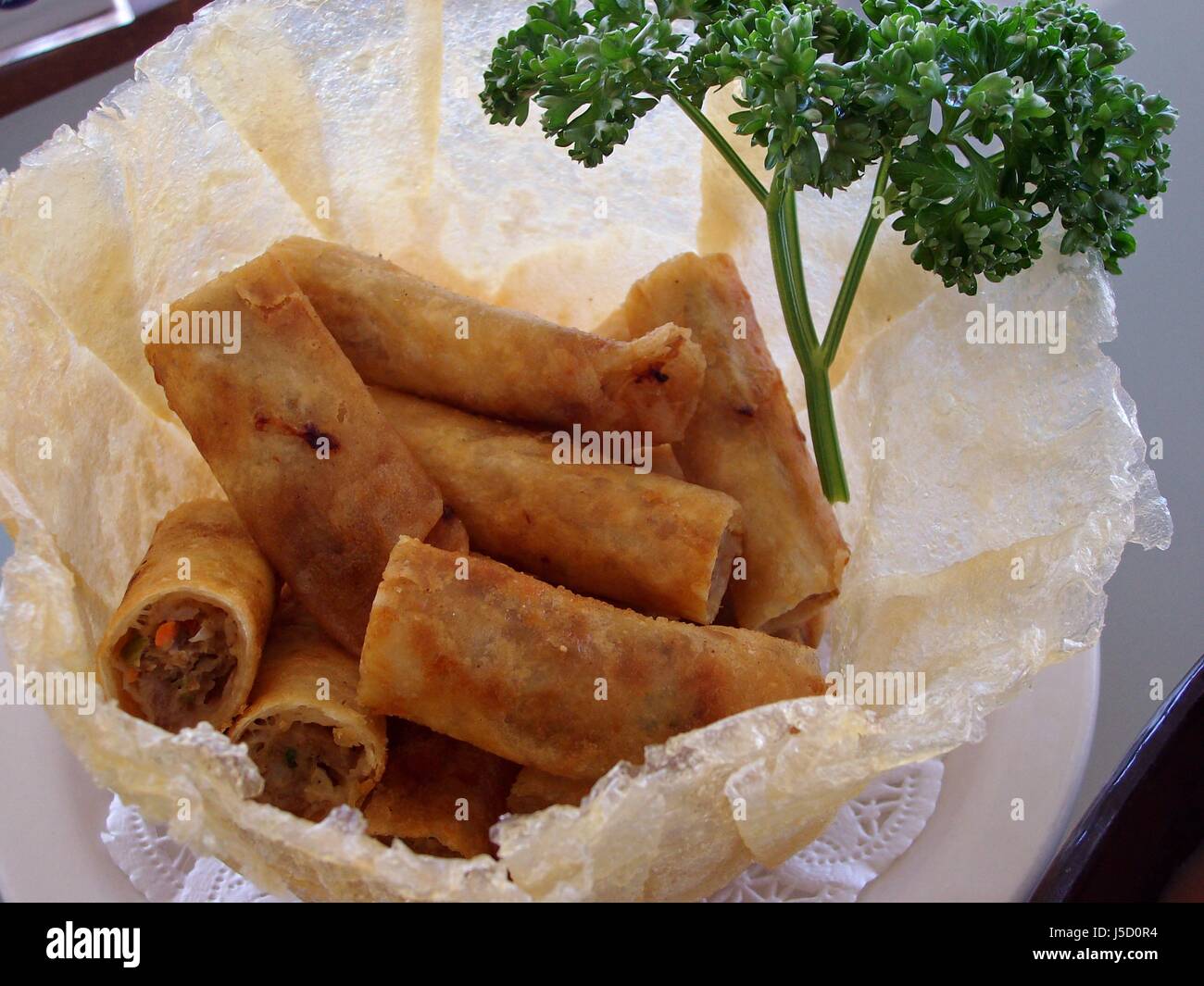 Vegetable rolls deep fried and served on a fresh spring roll wrapper in ...