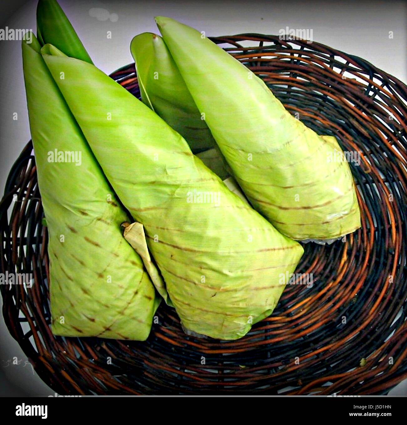 Philippine delicacy- Puto Maya in a basket tray Puto Maya is a steamed ...
