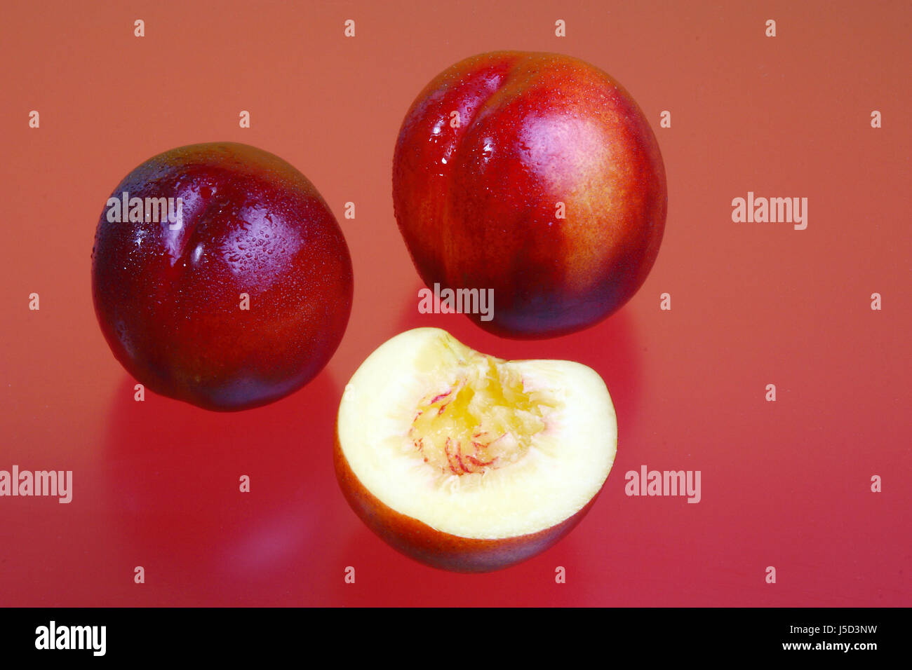 two and a half nectarines Stock Photo - Alamy