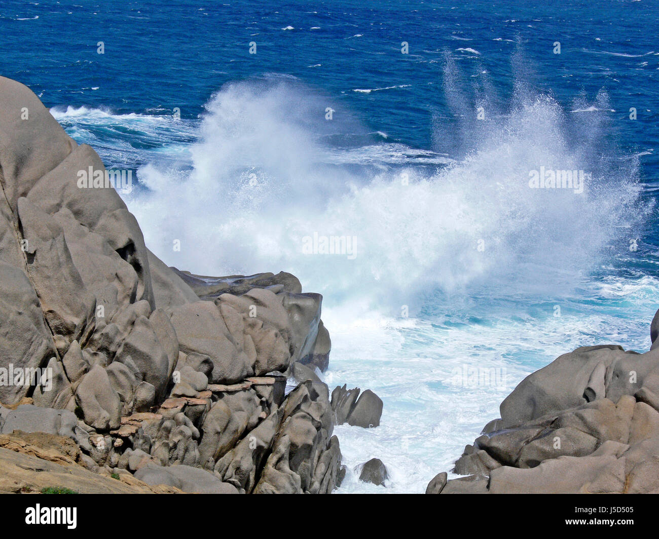 stone rock wave rocks salt water sea ocean water sardinia italy stones ...