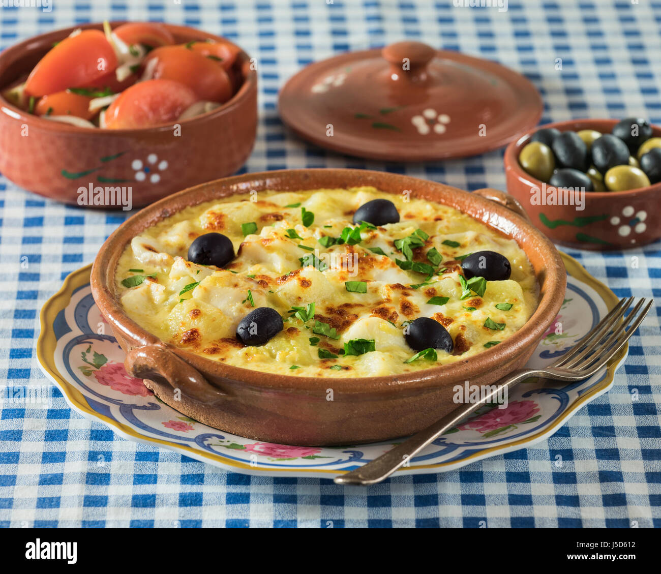 Bacalhau com natas. Portuguese salt cod with potatoes and cream ...