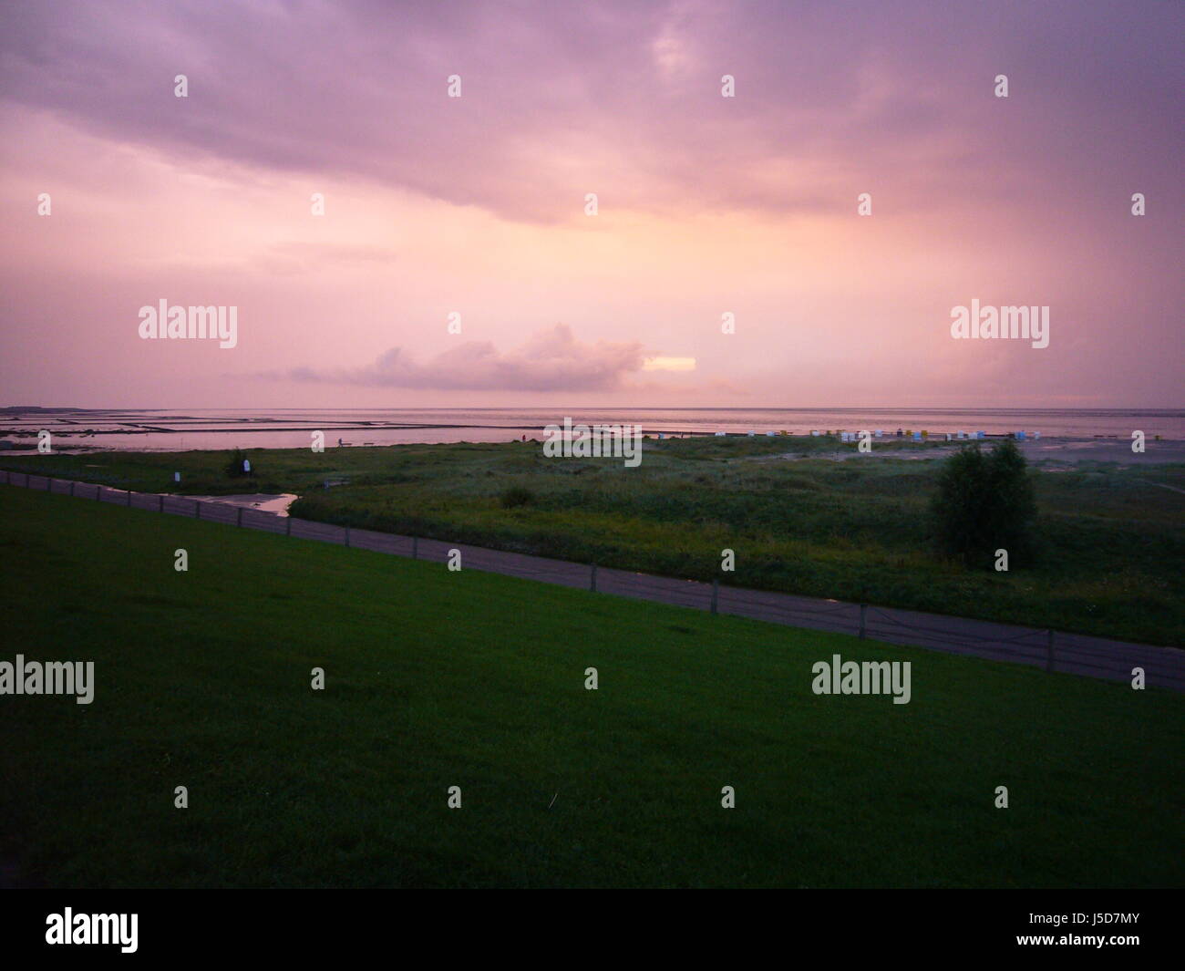 sunset water north sea salt water sea ocean watt beach chairs dike ...