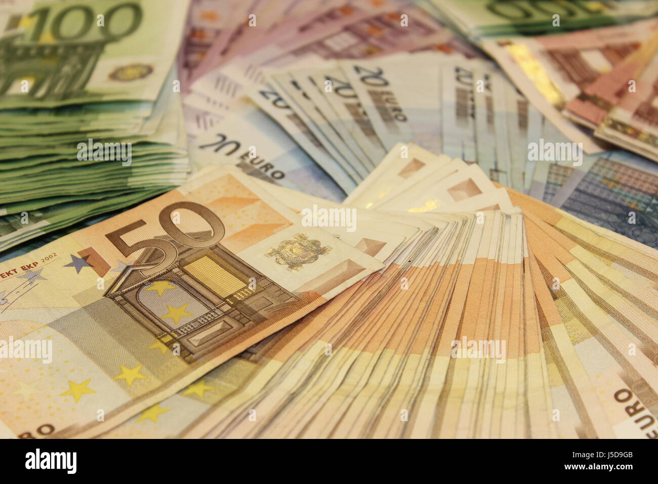 Pile of money Stock Photo - Alamy