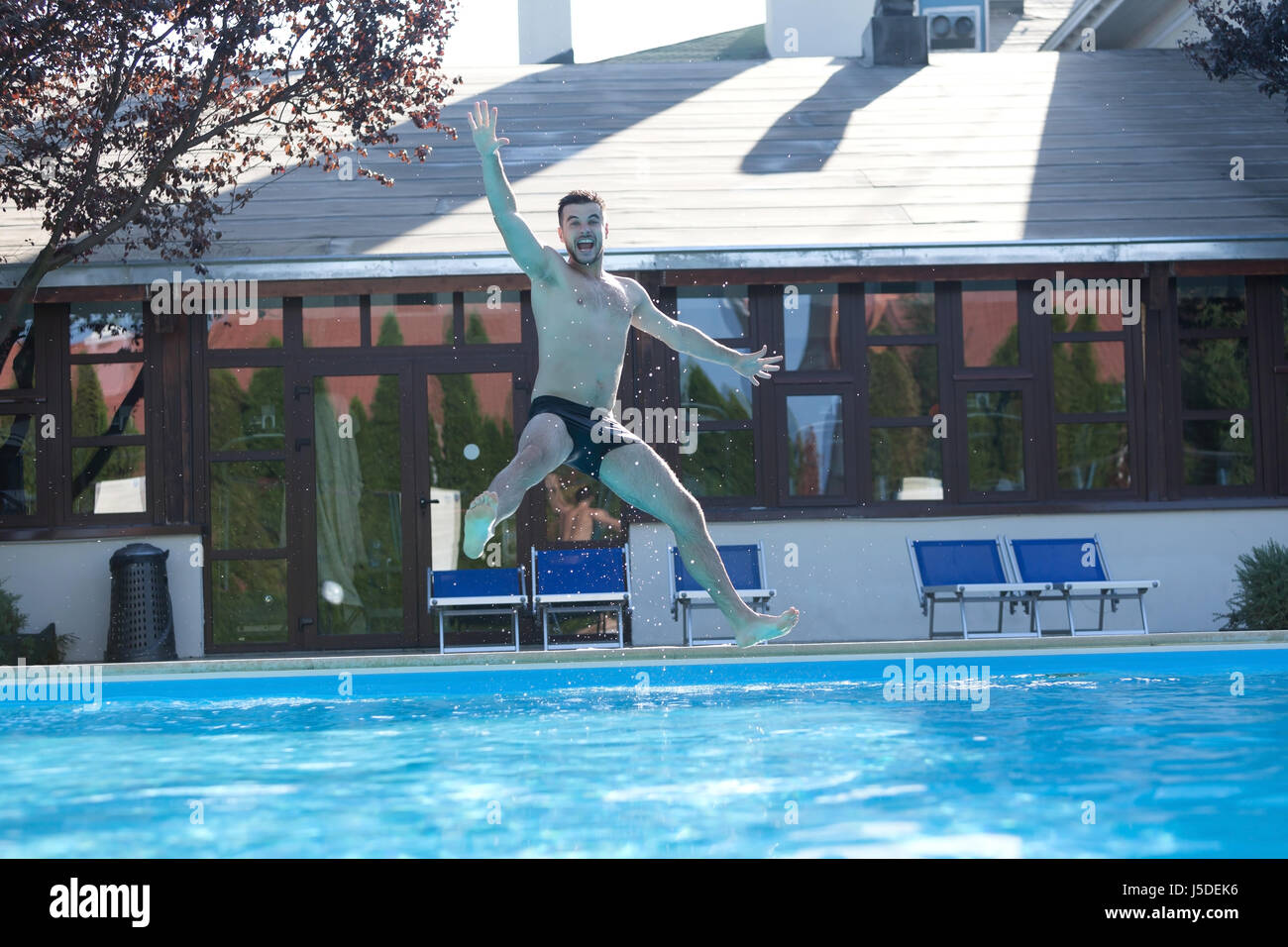 Businessman jumping in pool hi-res stock photography and images - Alamy
