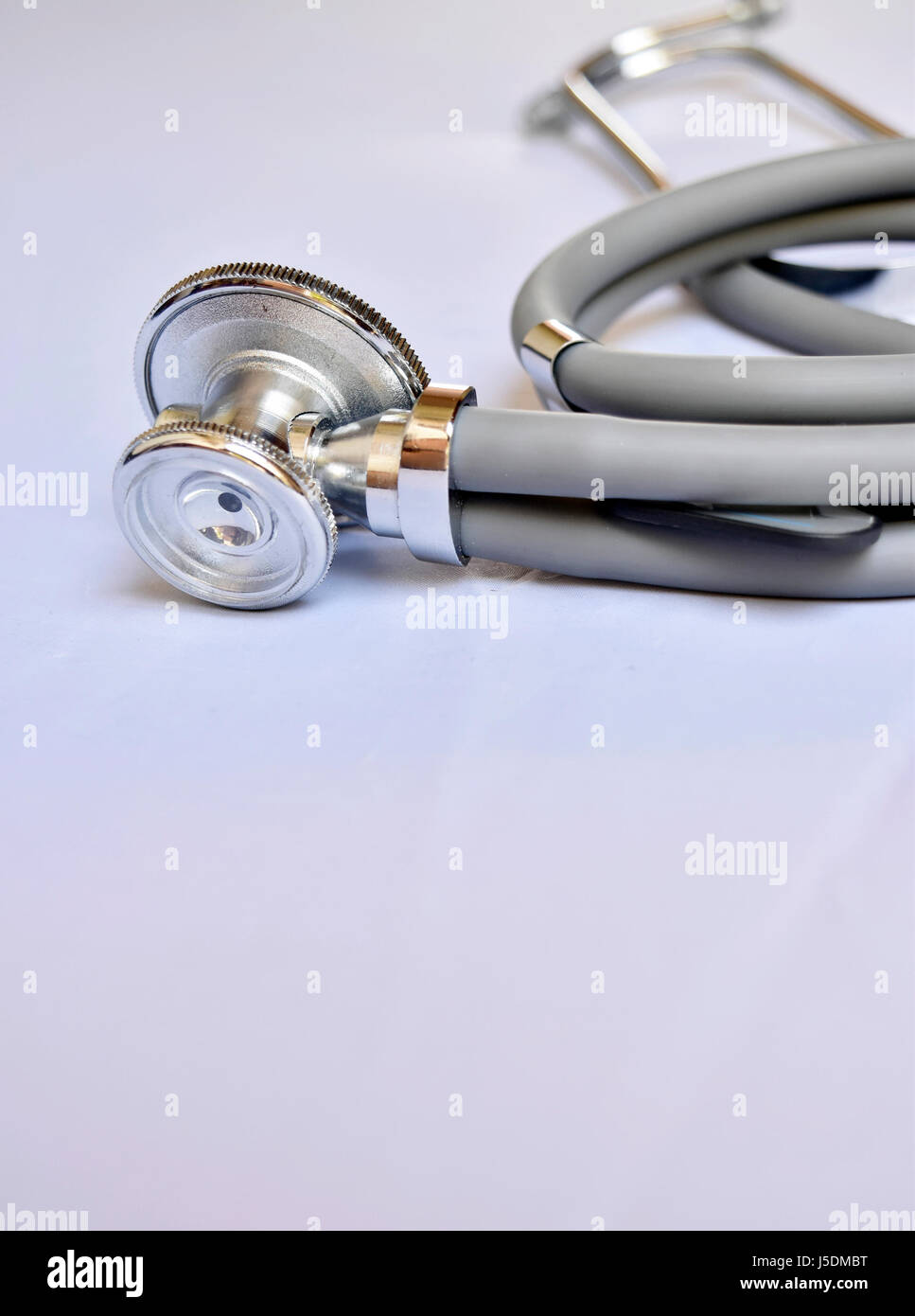 round fold Stethoscope in white clothe Stock Photo - Alamy
