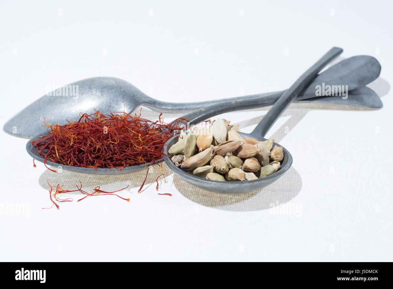 Raw Organic Red Saffron and Cardamom Spices Stock Photo - Alamy
