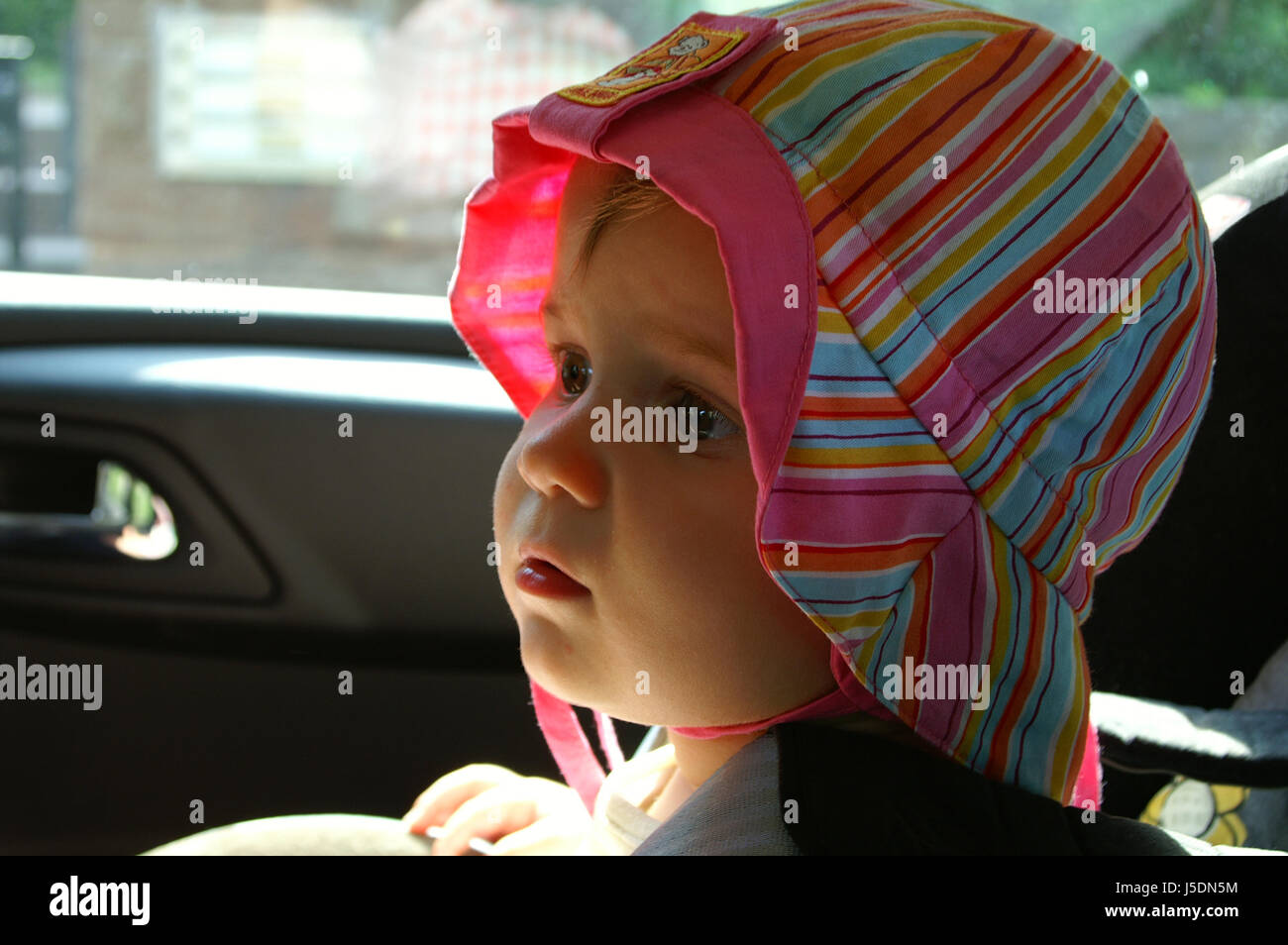 portrait look glancing see view looking peeking looking at baby cap ...