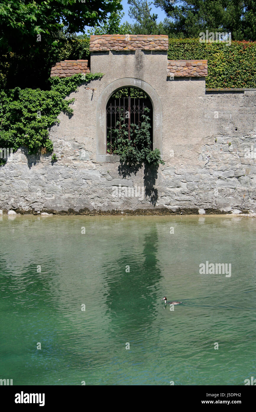 small moat with lattice window Stock Photo - Alamy
