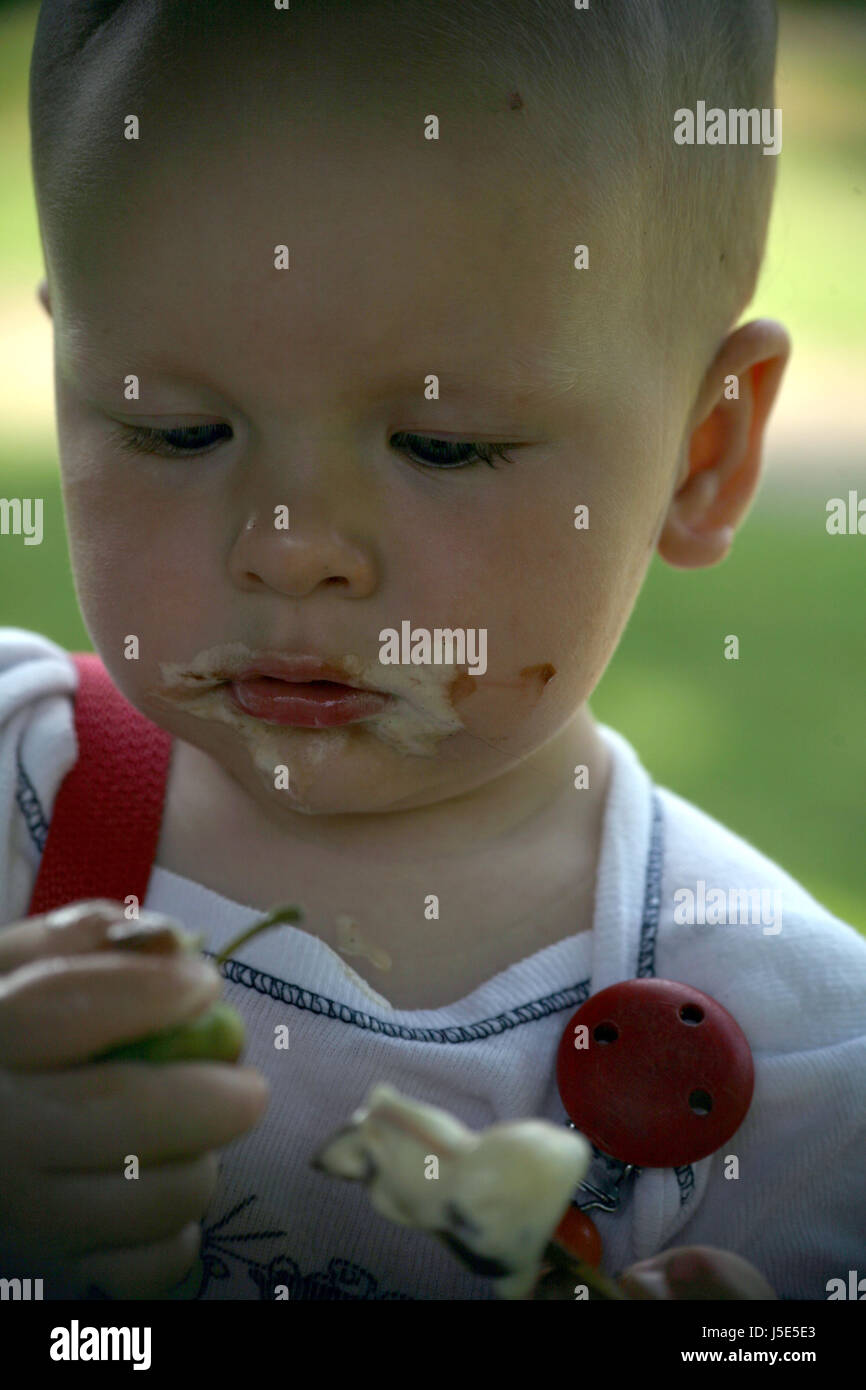 baby scribbling dainty sticky sweetness daubs lick ice cream ice-cream ...