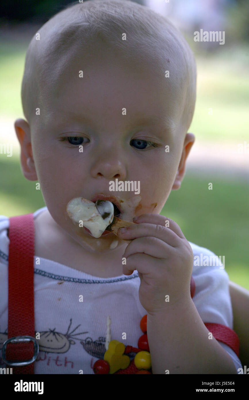 baby scribbling dainty sticky sweetness daubs lick ice cream ice-cream ...