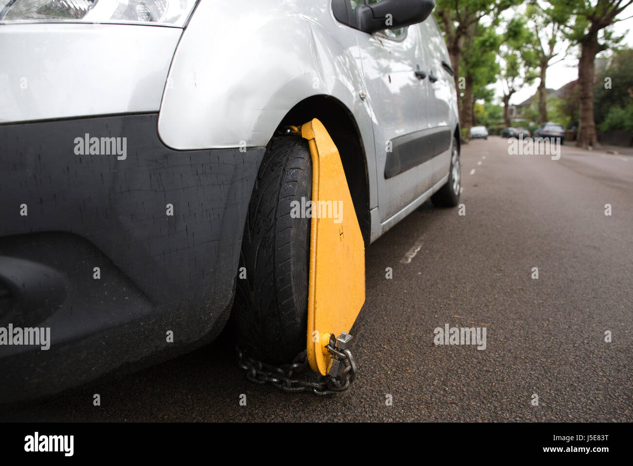 Impounded vehicle parked on street with vehicle immobiliser fitted ...