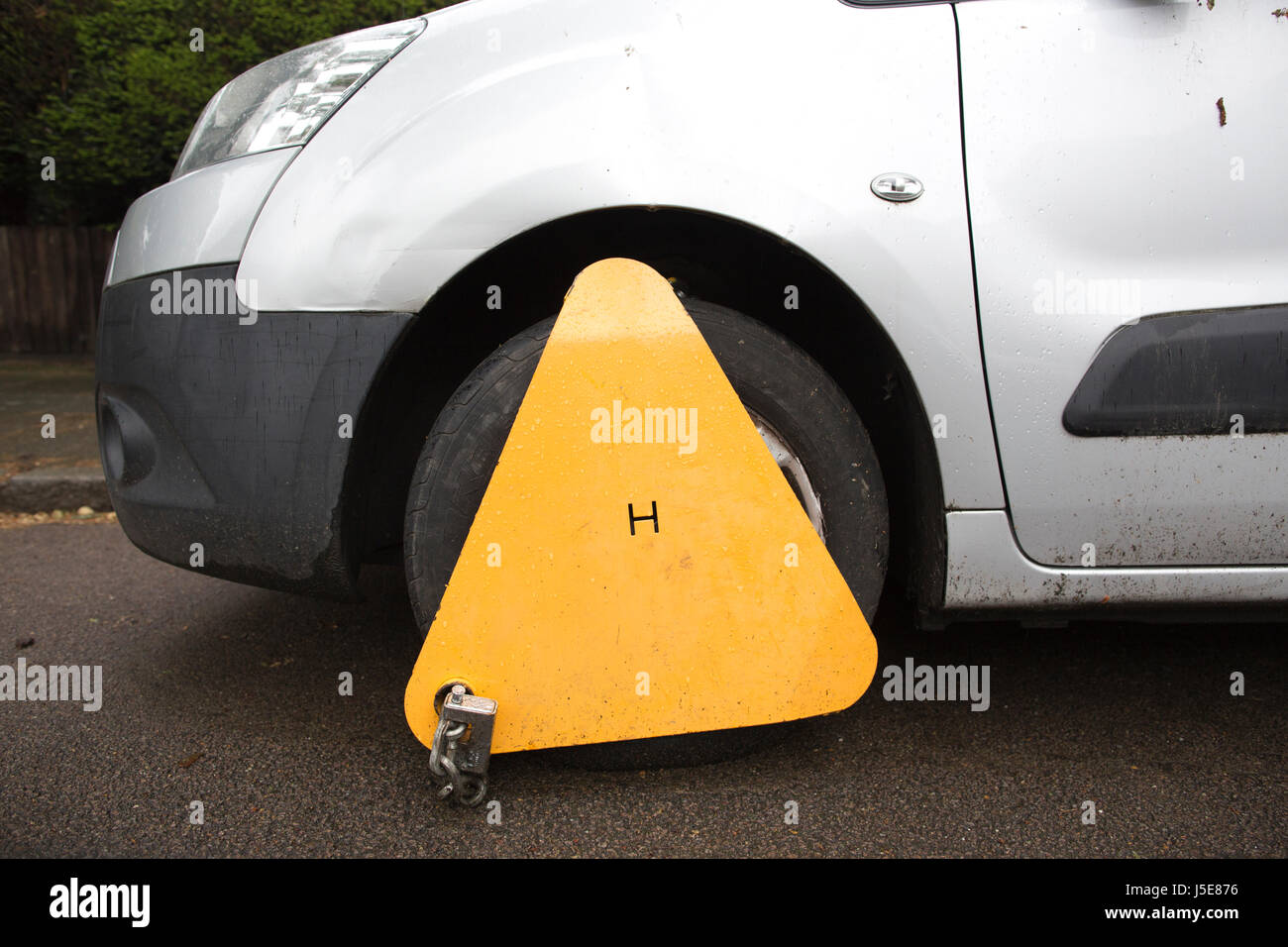 Impounded vehicle parked on street with vehicle immobiliser fitted ...