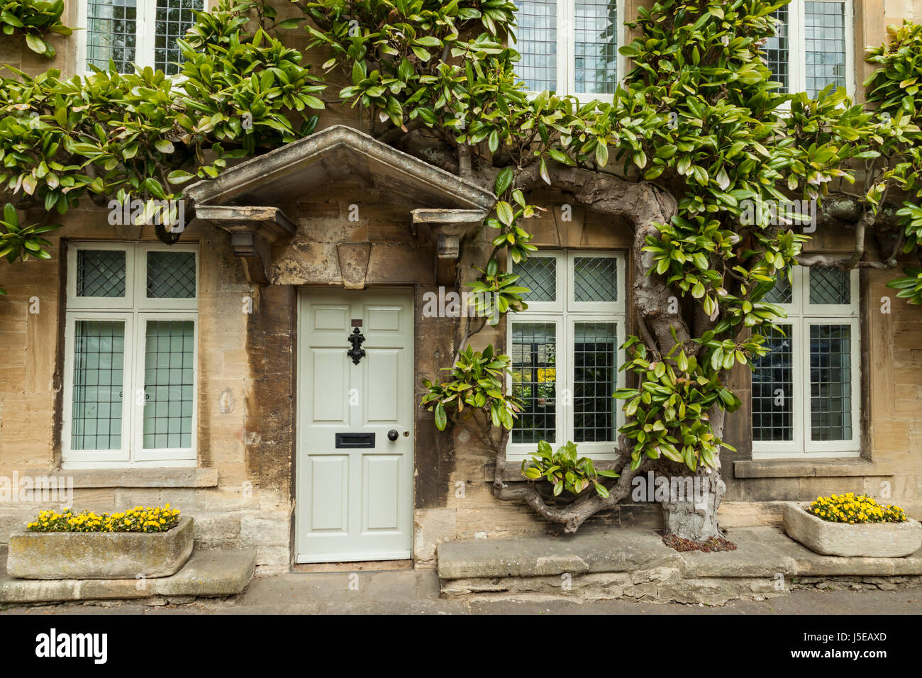 Traditional Cotswold house facade in Burford, Oxfordshire, England ...