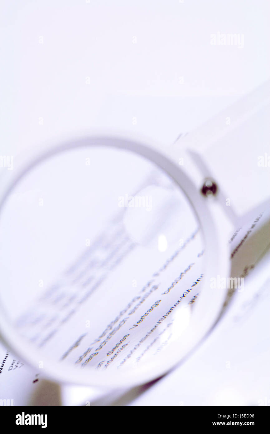 contract under the magnifying glass Stock Photo - Alamy