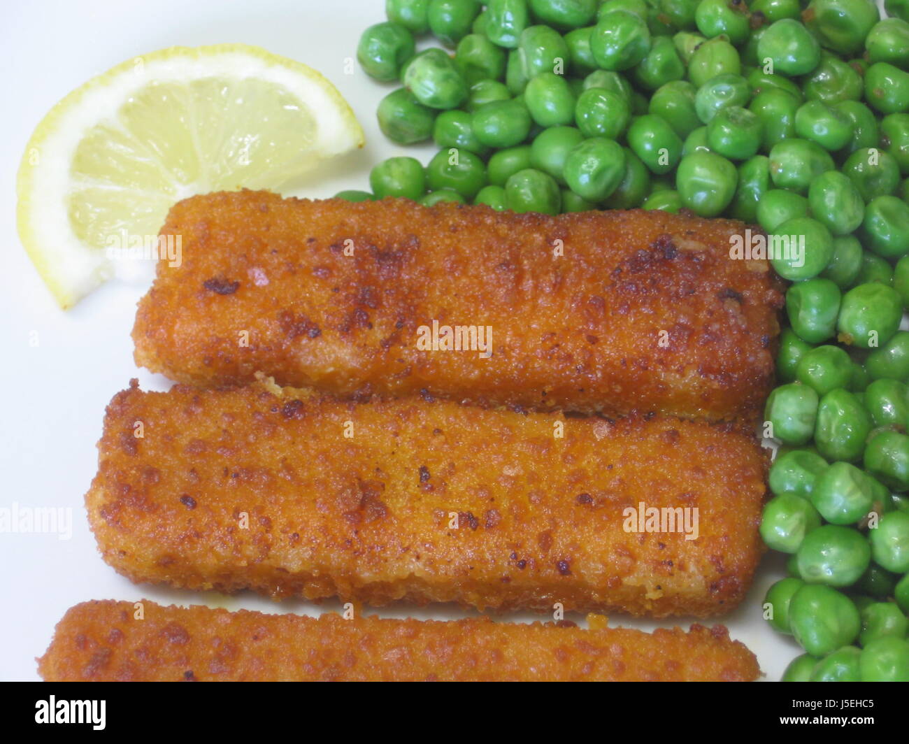 fish fingers with peas Stock Photo - Alamy