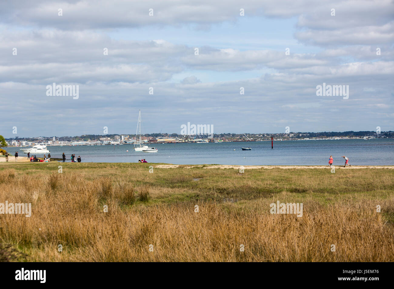 Tourist in the Arne beach viewing Poole from Arne RSPB reserve, Arne ...