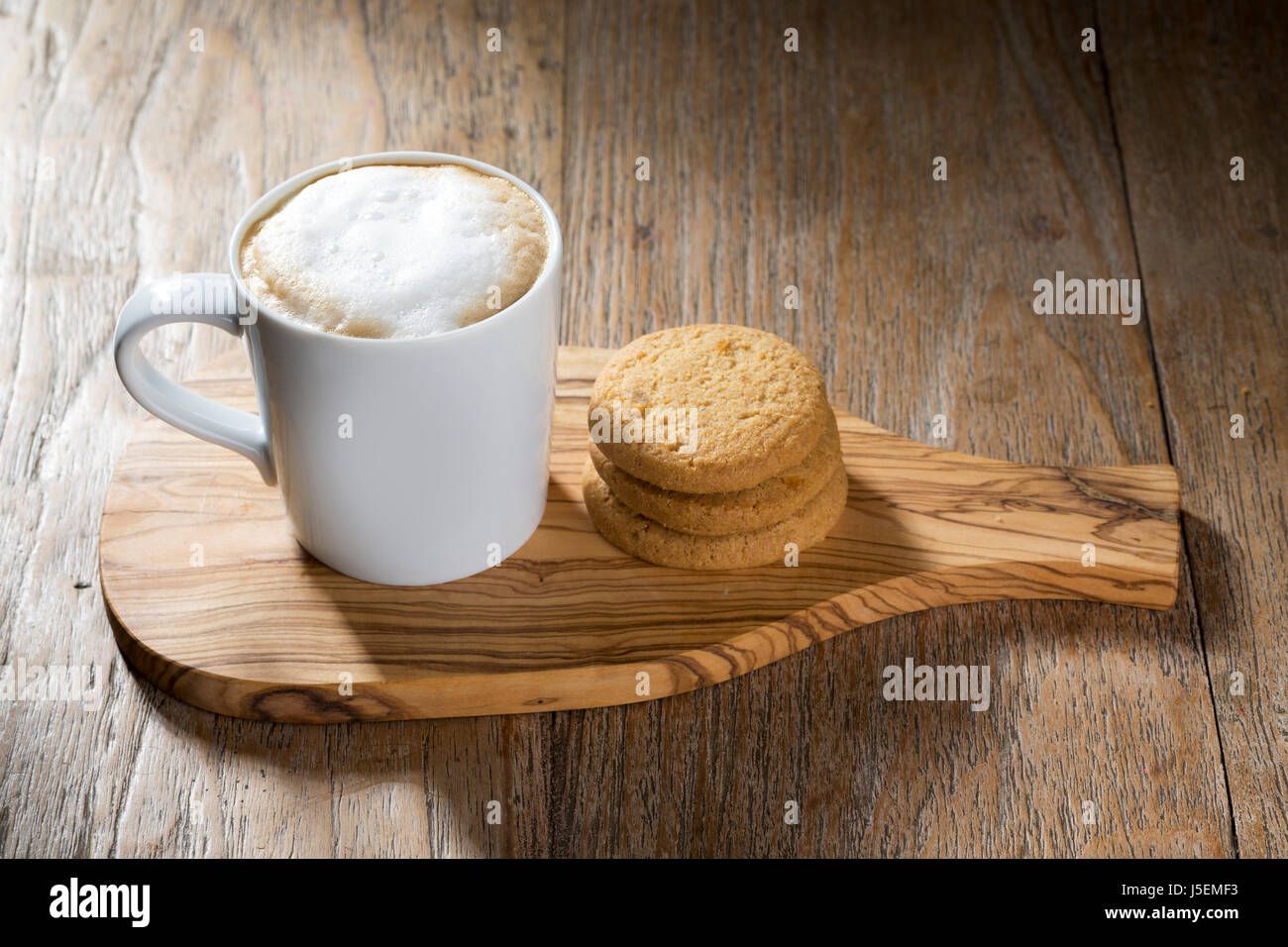 Cup of Coffee and Biscuits on a Rustic Wooden Table Stock Photo - Alamy