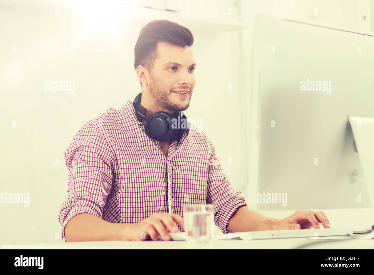creative man with headphones and computer Stock Photo - Alamy