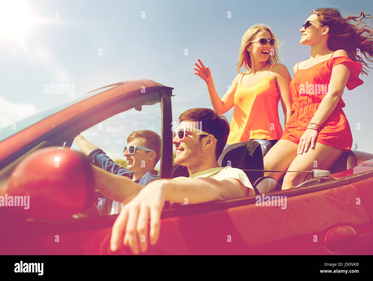 happy friends driving in cabriolet car Stock Photo - Alamy