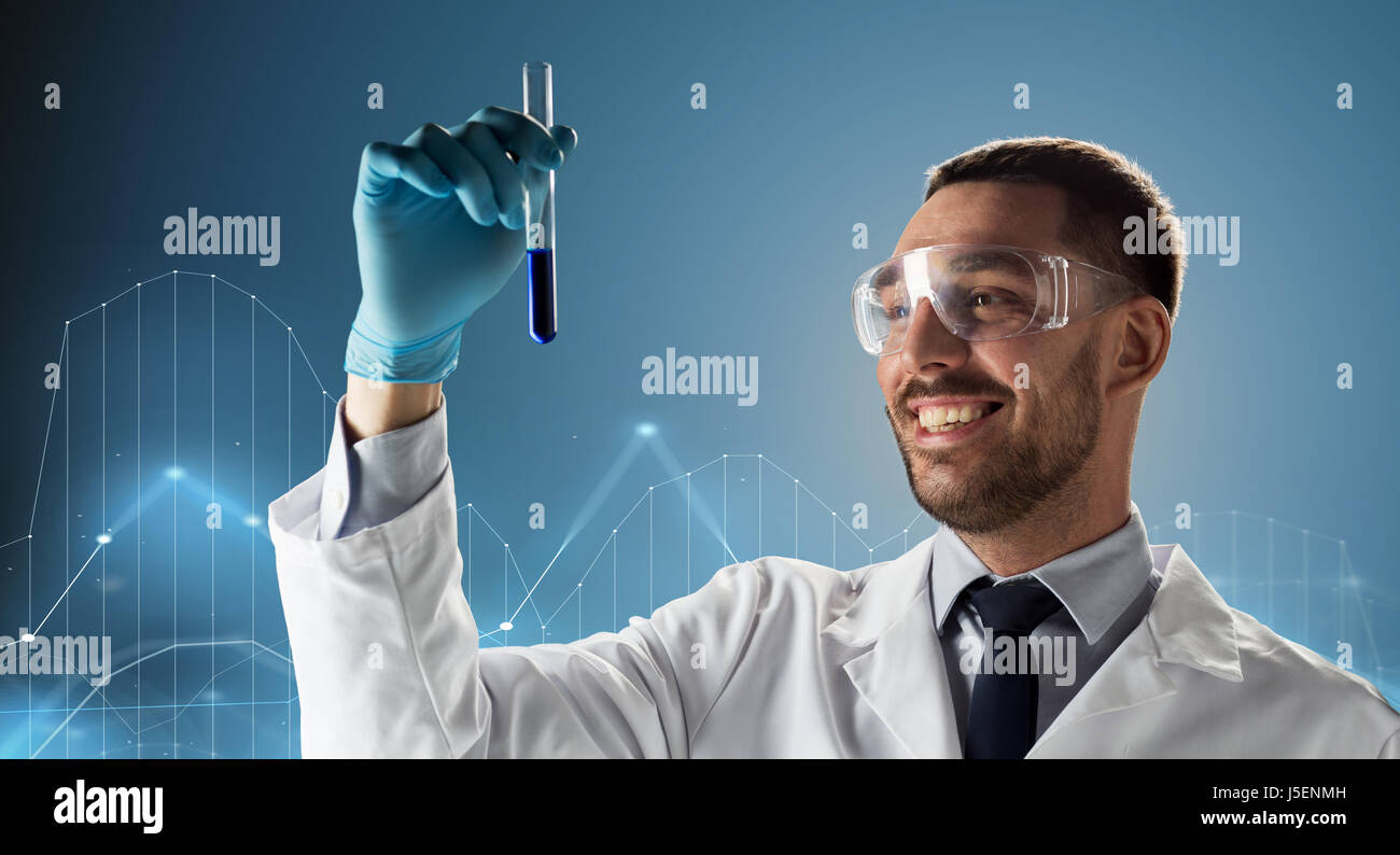 scientist in goggles with test tube and diagram Stock Photo - Alamy