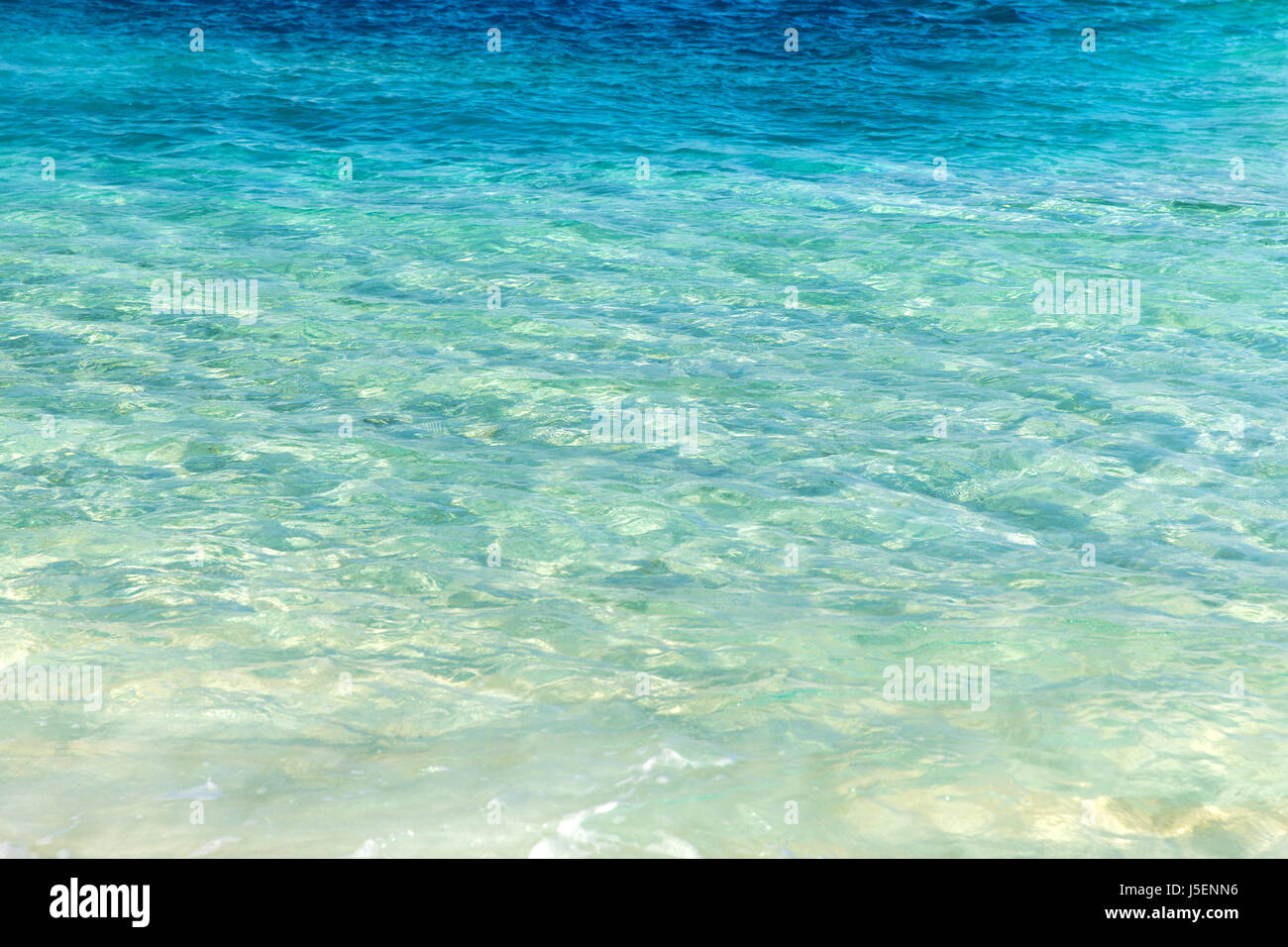 sea or ocean with transparent blue water Stock Photo - Alamy