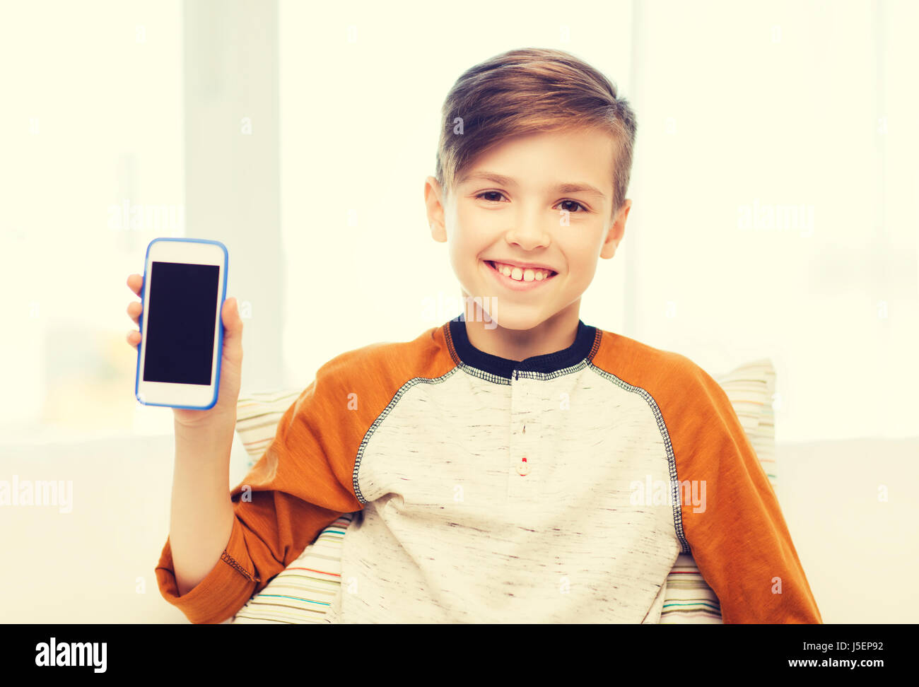 Teen boy smartphone advertising hi-res stock photography and images - Alamy