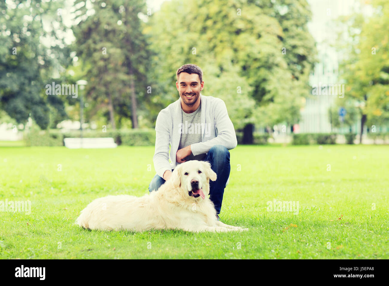 Happy guy with dog hi-res stock photography and images - Alamy