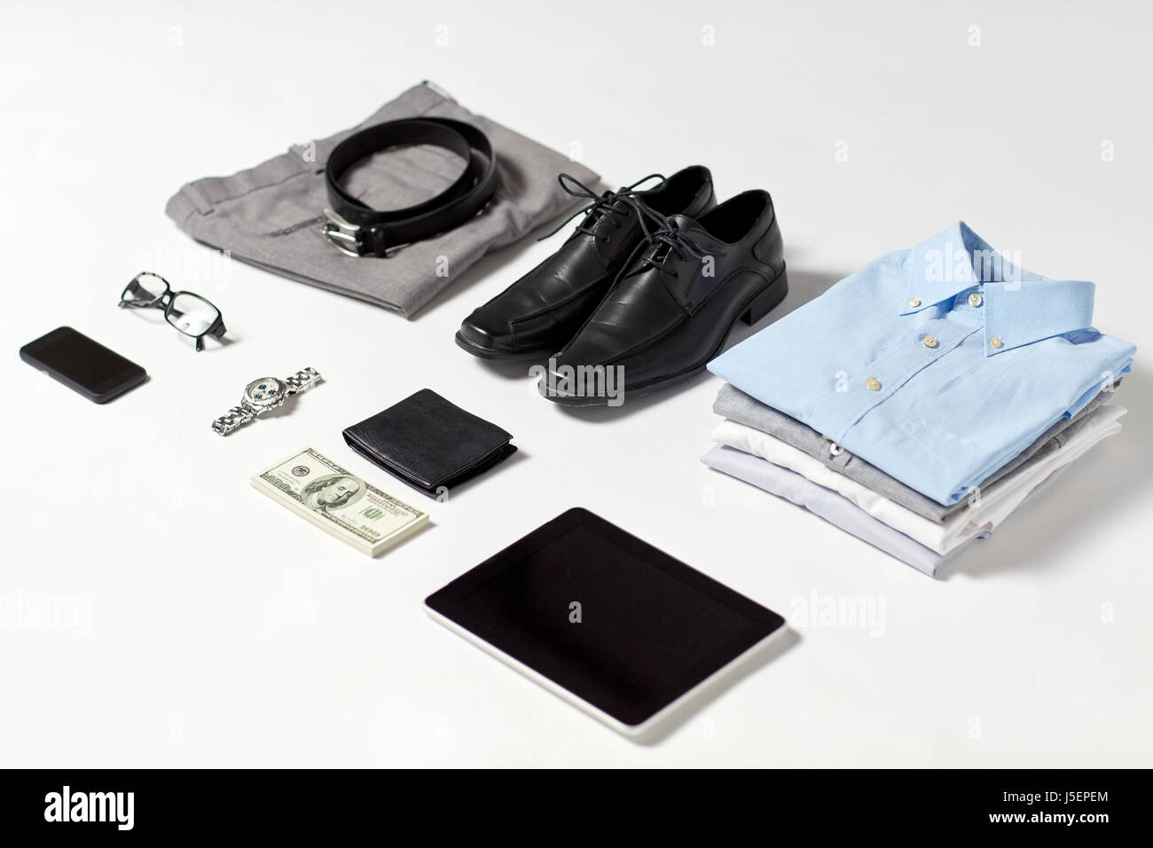 clothes, gadgets and business stuff on table Stock Photo - Alamy