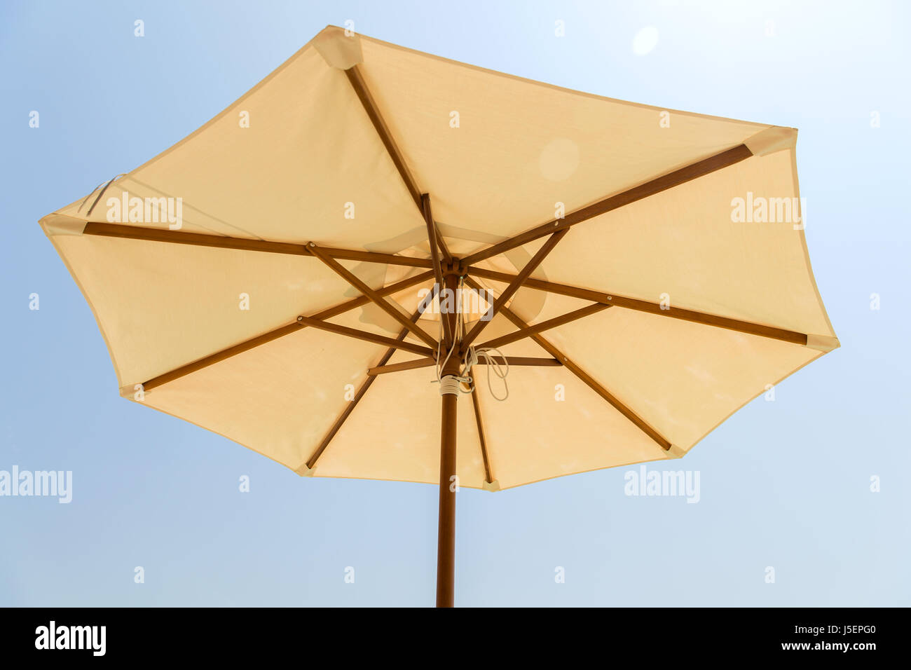 parasol over blue sky Stock Photo - Alamy